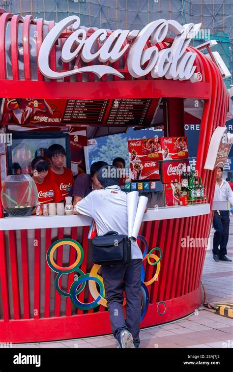 Beijing China Chinese Man Drinking Soda With Advertisement Exterior Soft Drink Kiosk