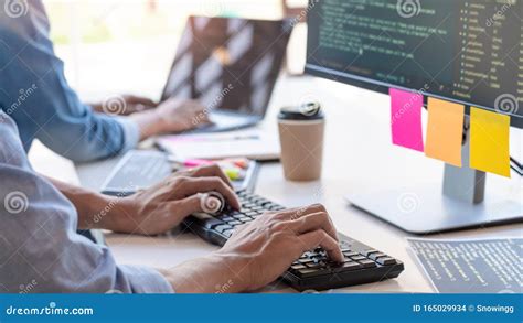 Pensive Programmer Working On On Desktop Pc Programming Code Technologies Or Website Design At