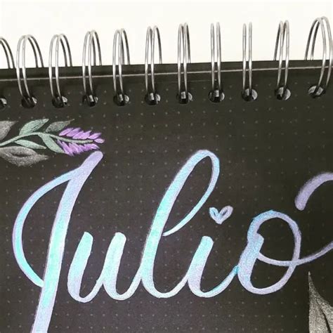 Julia In Cursive Writing On Black Paper