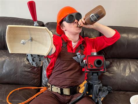 Cosplaying As The Team Fortress 2 Engineer Sipping Beer On A Couch