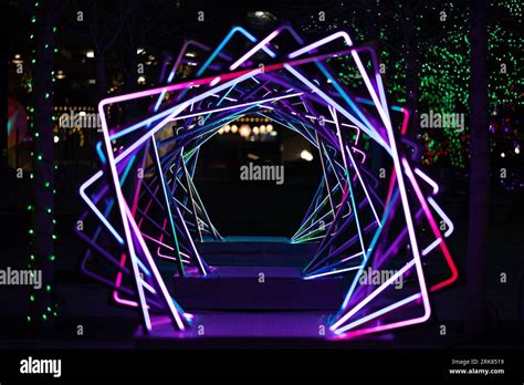 A Dazzling Neon Display Of Rotating Squares Illuminates The Night Sky