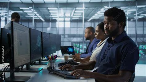 Developers In Data Center Workspace Implementing Ai Predictive Maintenance Systems Admin In