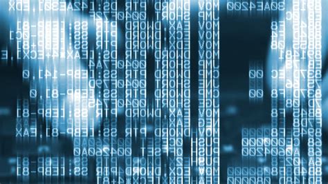 Man Typing On Keyboard With Computer Program Source Code In Front Seen From Behind The Display