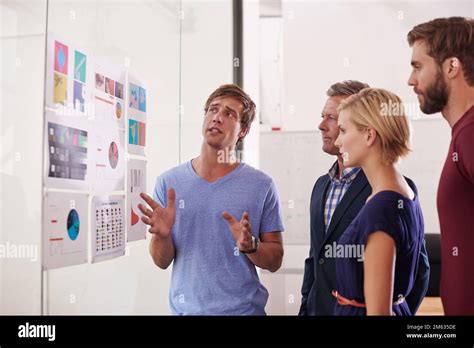 Innovation Distinguishes Between A Leader And A Follower A Man Presenting Data To His