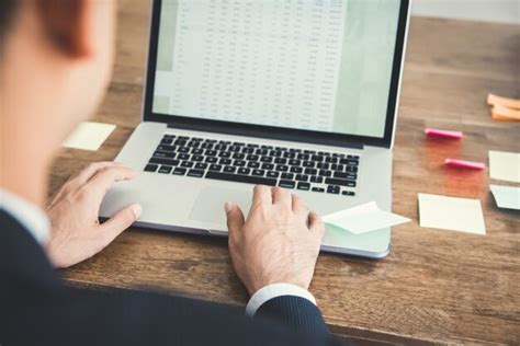 Premium Photo Businessman Concentrating On Using Laptop Computer Analysing Data On Screen