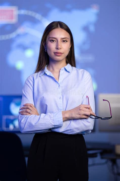 Confident Female Cybersecurity Analyst Or Manager In Large Cyber Security Operations Center Soc