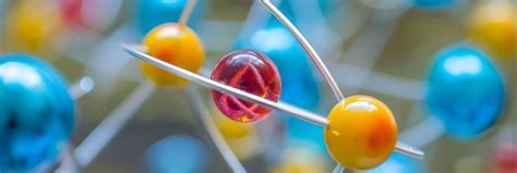 Colorful Orbiting Electrons Around Atomic Structure Premium Ai Generated Image