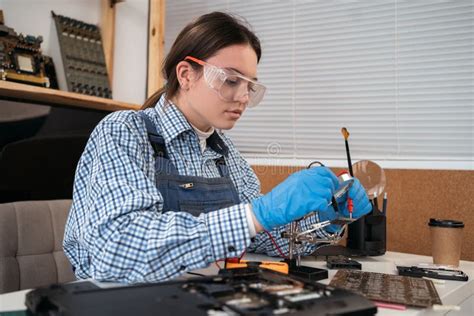 Computer Service And Repair Concept Woman Repairing The Broken Laptop Computer In Service