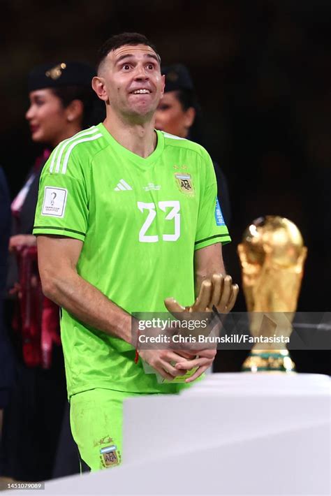 Emiliano Martinez Of Argentina Poses With The Golden Gloves Trophy