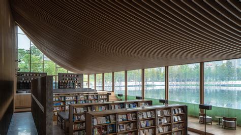 Muda Architects Designs Bookshop With Roof Shaped Like A Flipped Book