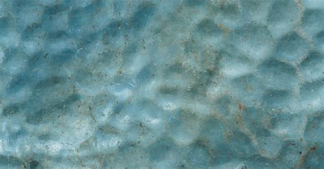 다음은 이미지에 대한 캡션입니다 청록색 색조의 질감이 있는 표면 사진 Unsplash의 텍스처 이미지