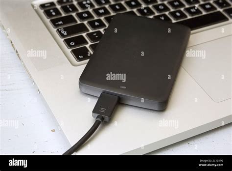 External Hard Disk Over Laptop Keyboard Stock Photo Alamy