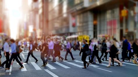 Crowd Of People Walking On Busy City Street At Rush Hour Traffic