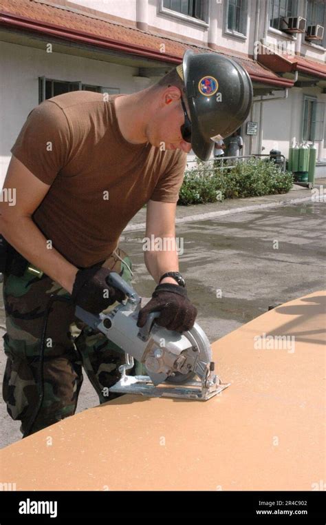 Us Navy Us Navy Constructionman Assigned To Naval Mobile Construction Battalion Four Zero