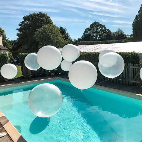 Floating Balloons Over Pool At Christian Liao Blog