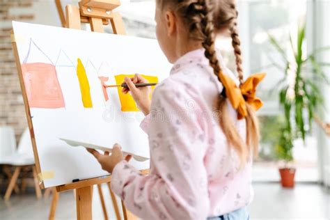 White Girl Drawing During Class In Art School Indoors Stock Image