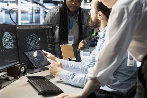 Engineering Team Doing Brainstorming In Data Center Using Ai Powered