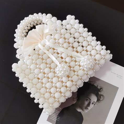 2021 럭셔리 디자이너 핸드백 여성용 탑 핸들 백 프랑스 스타일 베이베리 볼 직조 비즈 진주 파티 Abs 이브닝 백 패션탑 핸드백 Aliexpress