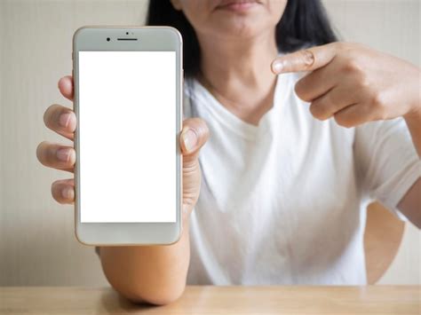 Premium Photo Mockup Image Of Asian Woman Pointing Finger At A Mobile