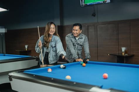 Premium Photo Male Pool Player Paying Attention On The Female Pool Player That Pointing On The