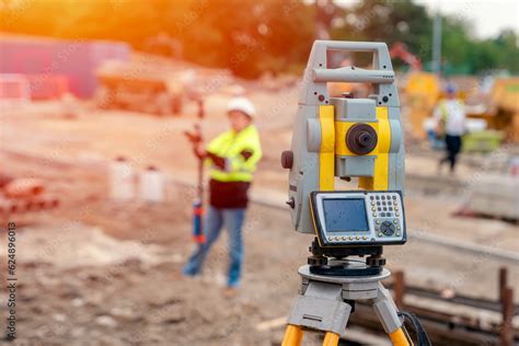Female Site Engineer Surveyor Working With Theodolite Total Station Edm