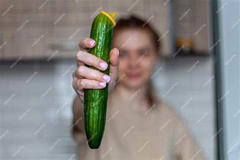 Premium Photo Cucumber With A Condomwoman Holding A Cucumber With A Condom Sex Education