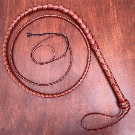 A 7 Foot 16 Plait Tachi Model Bull Whip In Natural Tan And Red Rwhips