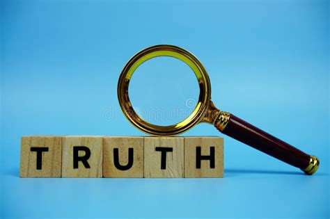 Truth With Wooden Blocks Alphabet Letters And Magnifying Glass On Blue Background Stock Image