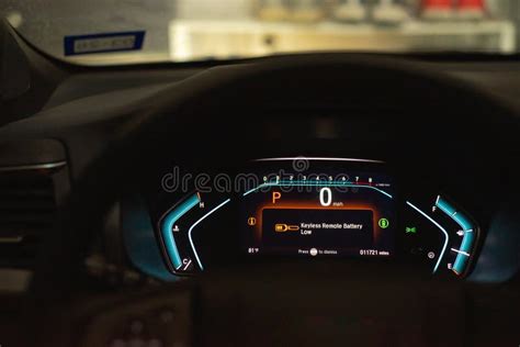 Garage Parked Modern Minivan Car With Keyless Remote Battery Low Warning Indicator On