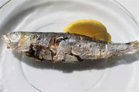 Grilled Sardines On Sea Salt With Lemon