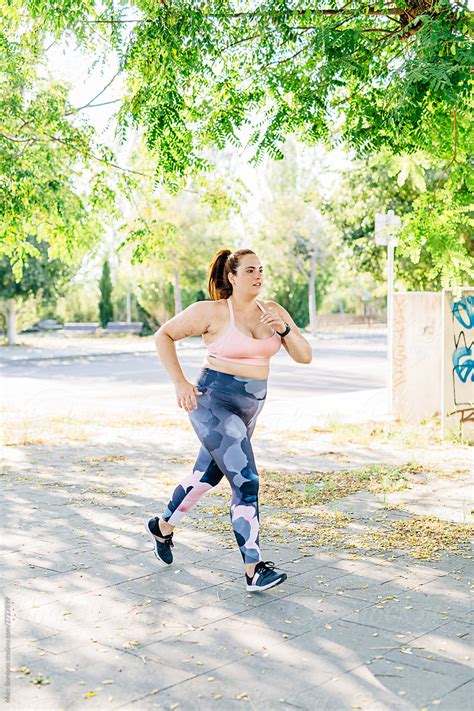 Curvy Young Girl Running By Stocksy Contributor Marc Bordons Stocksy