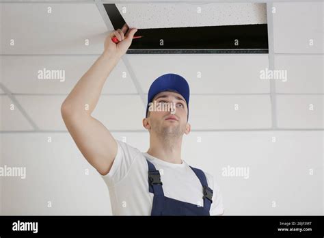 Electrician Repairing Ceiling Light Stock Photo Alamy