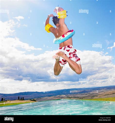 Man Jumping In Swimming Pool Stock Photo Alamy