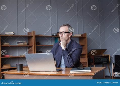 Man Sitting At A Desk And Looking Into His Computer Stock Image Image Of Online Adult 262749285