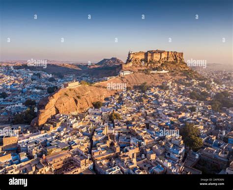 Aerial View Of Mehrangarh Fort At Sunset Sits Above The Blue City