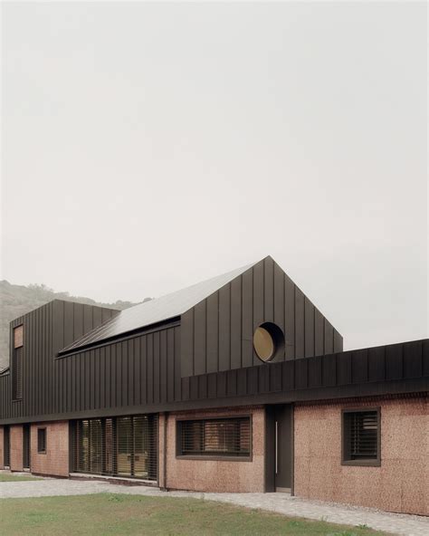 lca architetti nestles angular cork clad home into italian valley