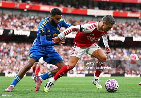 Leandro Trossard Of Arsenal Is Closed Down By Jayden Bogle Of Leeds