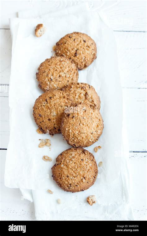 Homemade Oatmeal Cookies With Flax And Sesame Seeds On White Wooden
