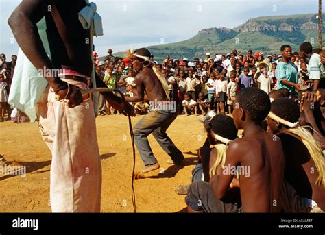 People Watch A Dance Performance By Members Of Their Zulu Tribe Stock