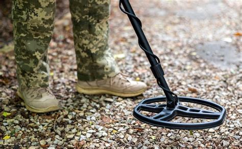 Premium Photo Military Sapper With A Metal Detector In The Field