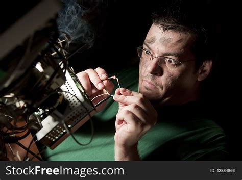 Man Repairing Computer On Fire Free Stock Images Photos StockFreeImages Com
