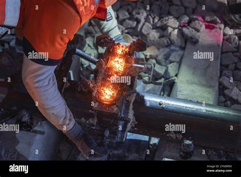 Welding Work On A Rail With Sparks Worker Handling Tools Intense