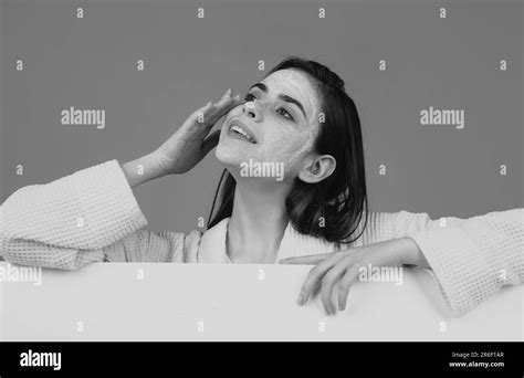 Beautiful Young Woman With Clean Fresh Skin Applying Face Cream Facial