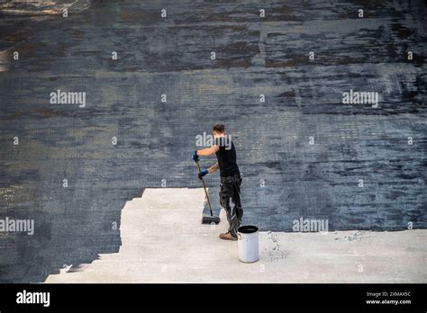 Construction Site Application Of A Bitumen Coating To A Concrete