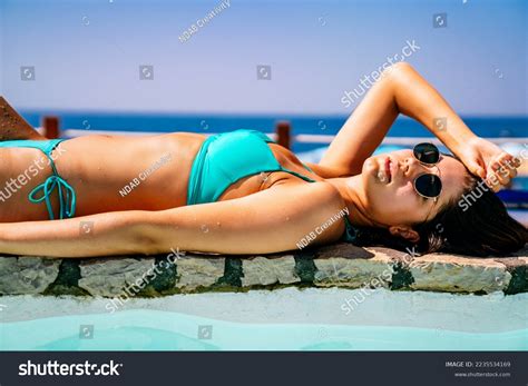 Sexy Girl Sunbathing On Beach Enjoying Stock Photo 2235534169 Shutterstock