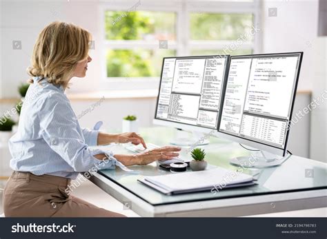 Programmer Woman Coding On Multiple Computer Stock Photo 2194798783 Shutterstock