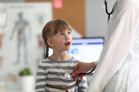 Premium Photo Smiling Girl At Doctor Office In Clinic