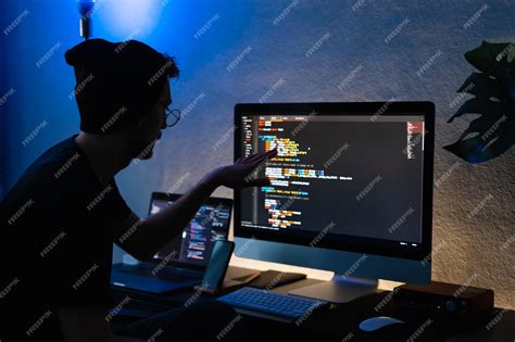 Premium Photo Young Man Mobile Developer Writes Program Code On A