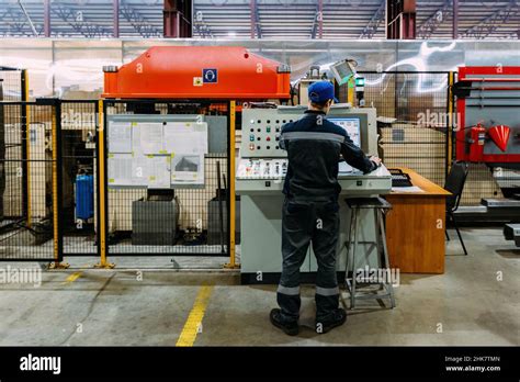 Factory Worker Operating CNC Machine In Metalworking Workshop Stock Photo Alamy