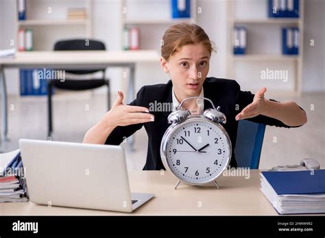 Female Employee In Time Management Concept Stock Photo Alamy